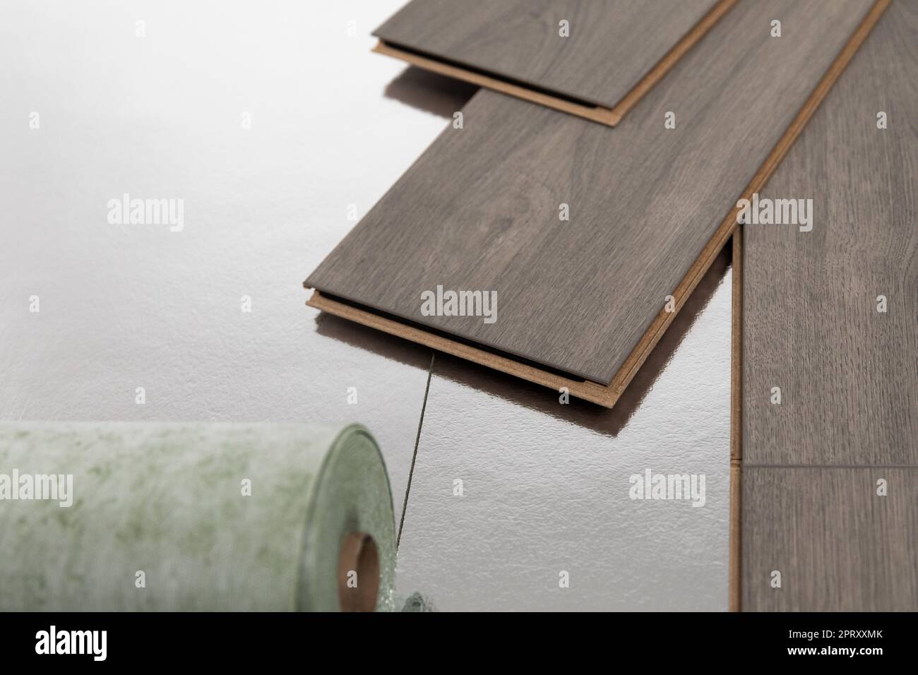 Installation of floating floor, underlay with sheets of laminate. Home ...