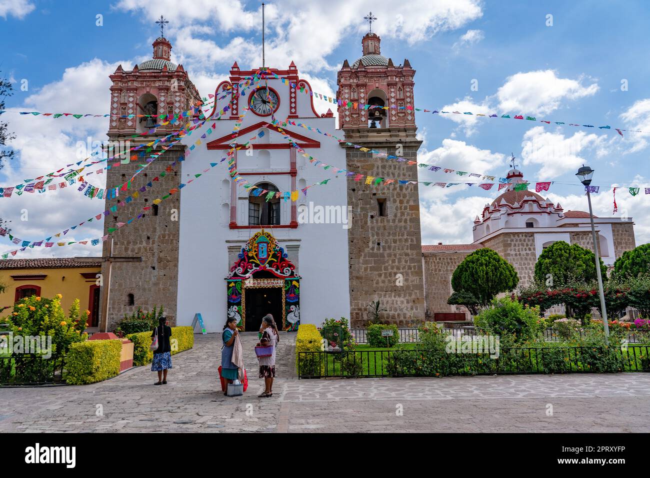 Indigenous Zapotec women in traditional dress in front of the church in ...