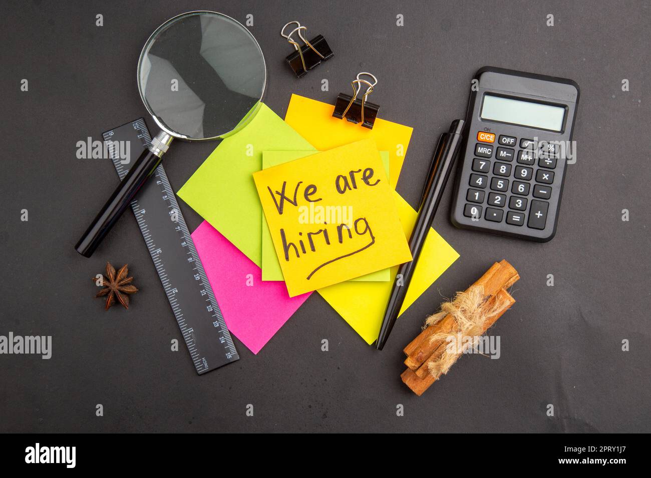 top view we are hiring written on sticky note colorful sticky notes ...