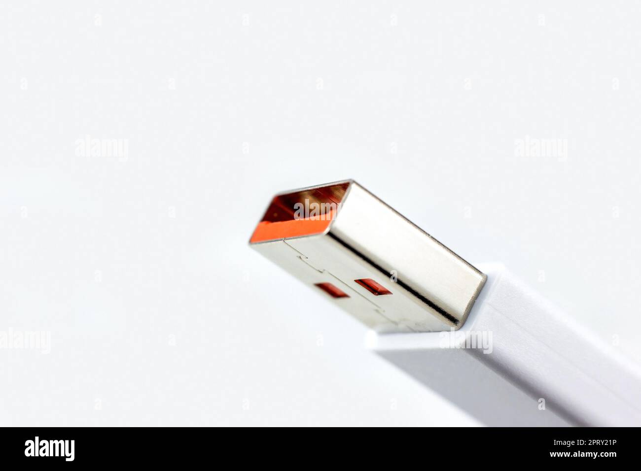 White USB cable connector close up on light background with copy space ...