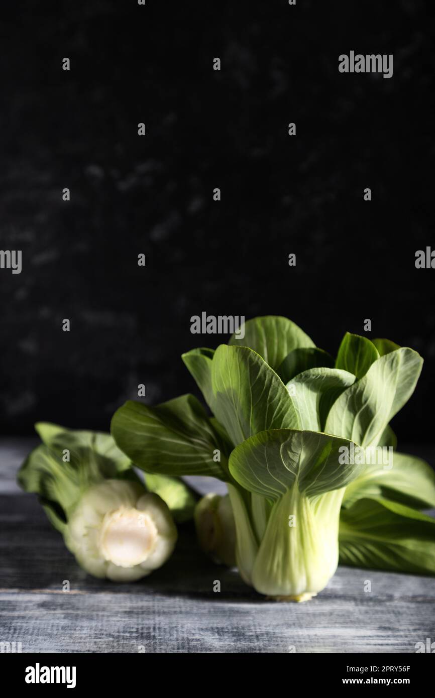 Fresh green bok choy or pac choi chinese cabbage on a gray wooden ...