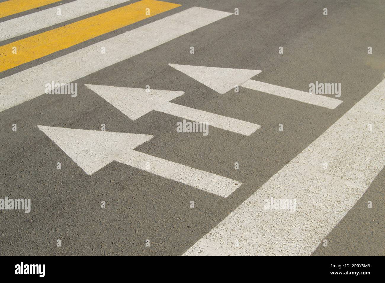 Asphalt road with arrow sign shows the direction of movement Stock ...