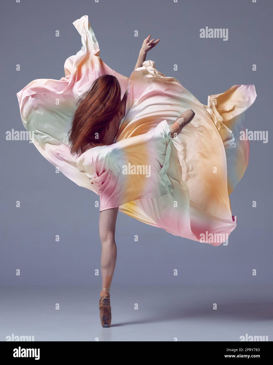 One young adorable ballerina with red hair emotional dancing with over ...