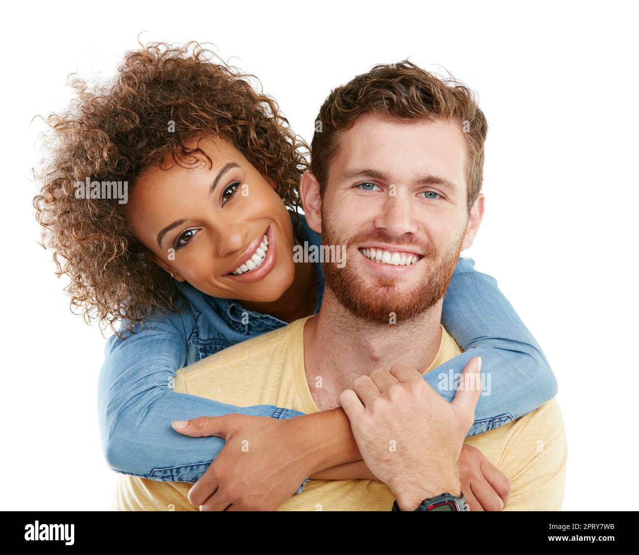 I love him to bits. Studio portrait of an affectionate young woman hugging her boyfriend against ...