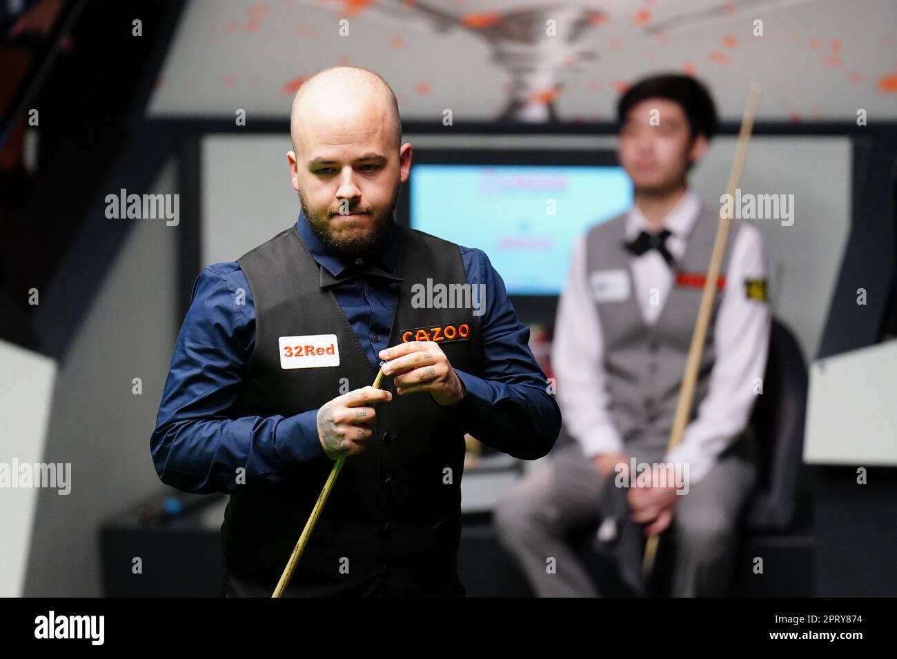 Luca Brecel in action against Si Jiahui (right) on day thirteen of the ...