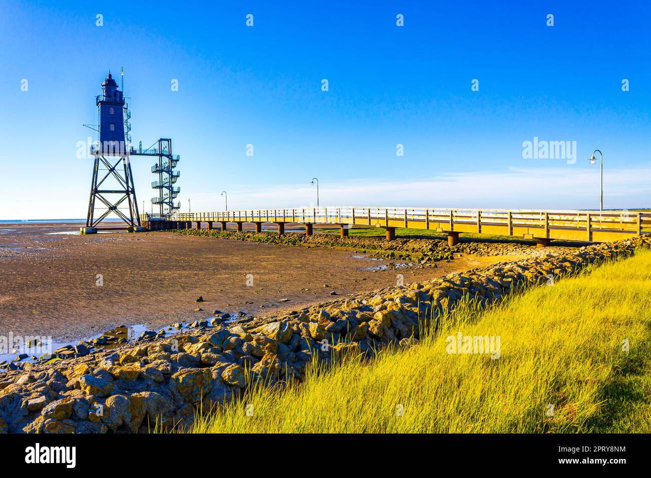 Black lighthouse tower Obererversand in Wadden Sea landscape in Dorum ...