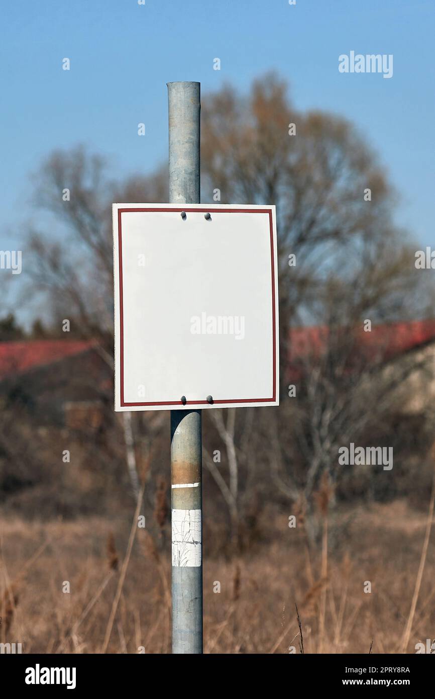 Empty signboard on a piece of ground Stock Photo - Alamy