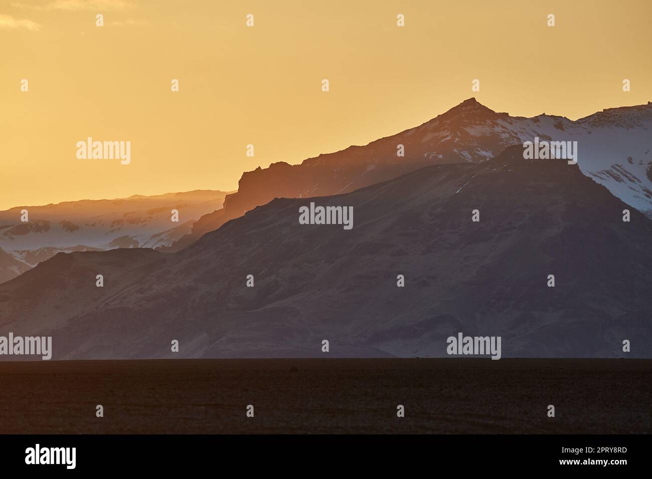 Twilight landscape with mountains and dim road Stock Photo - Alamy