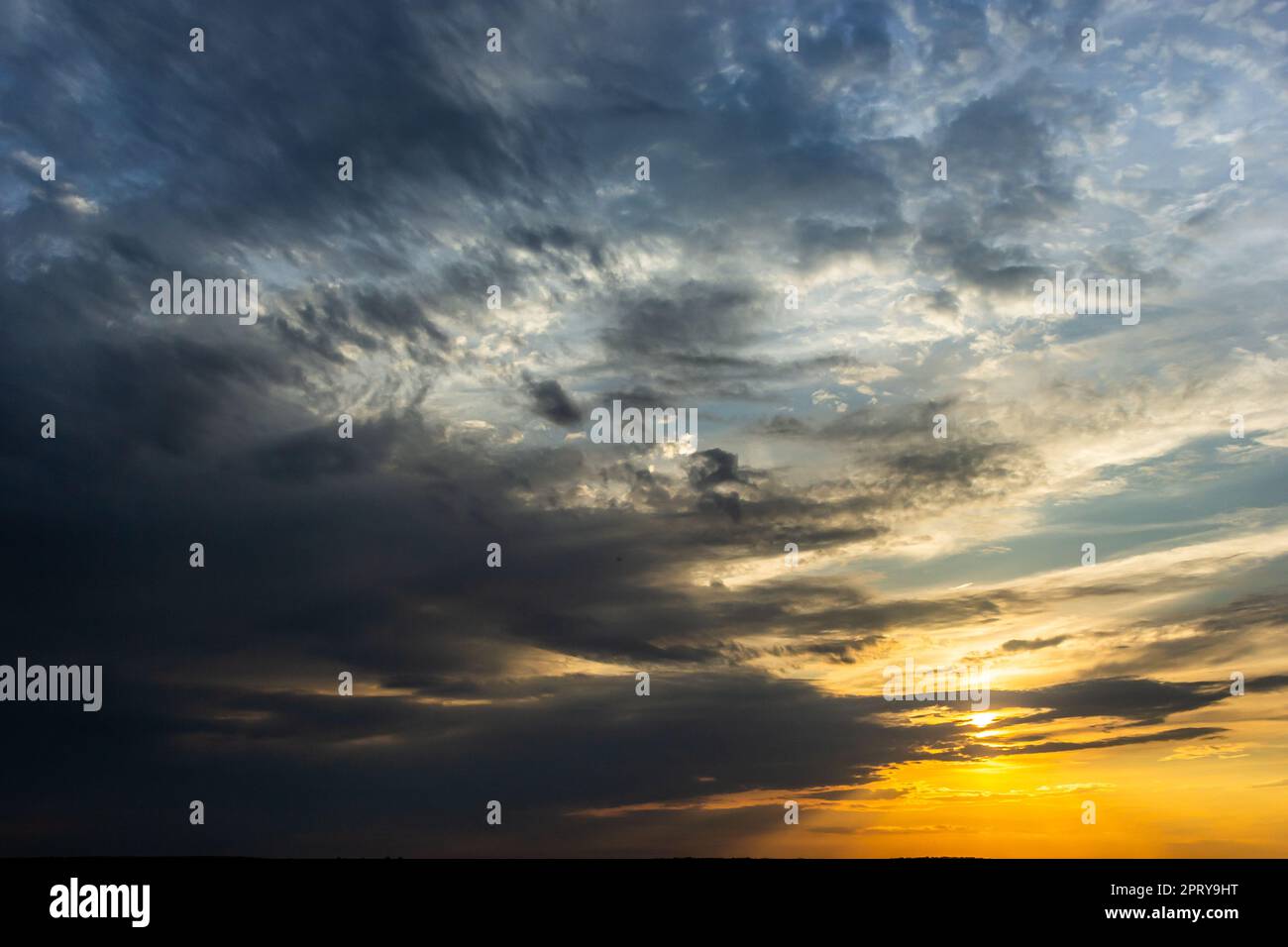 sunset sky with multicolor clouds. Dramatic twilight sky background Stock Photo - Alamy
