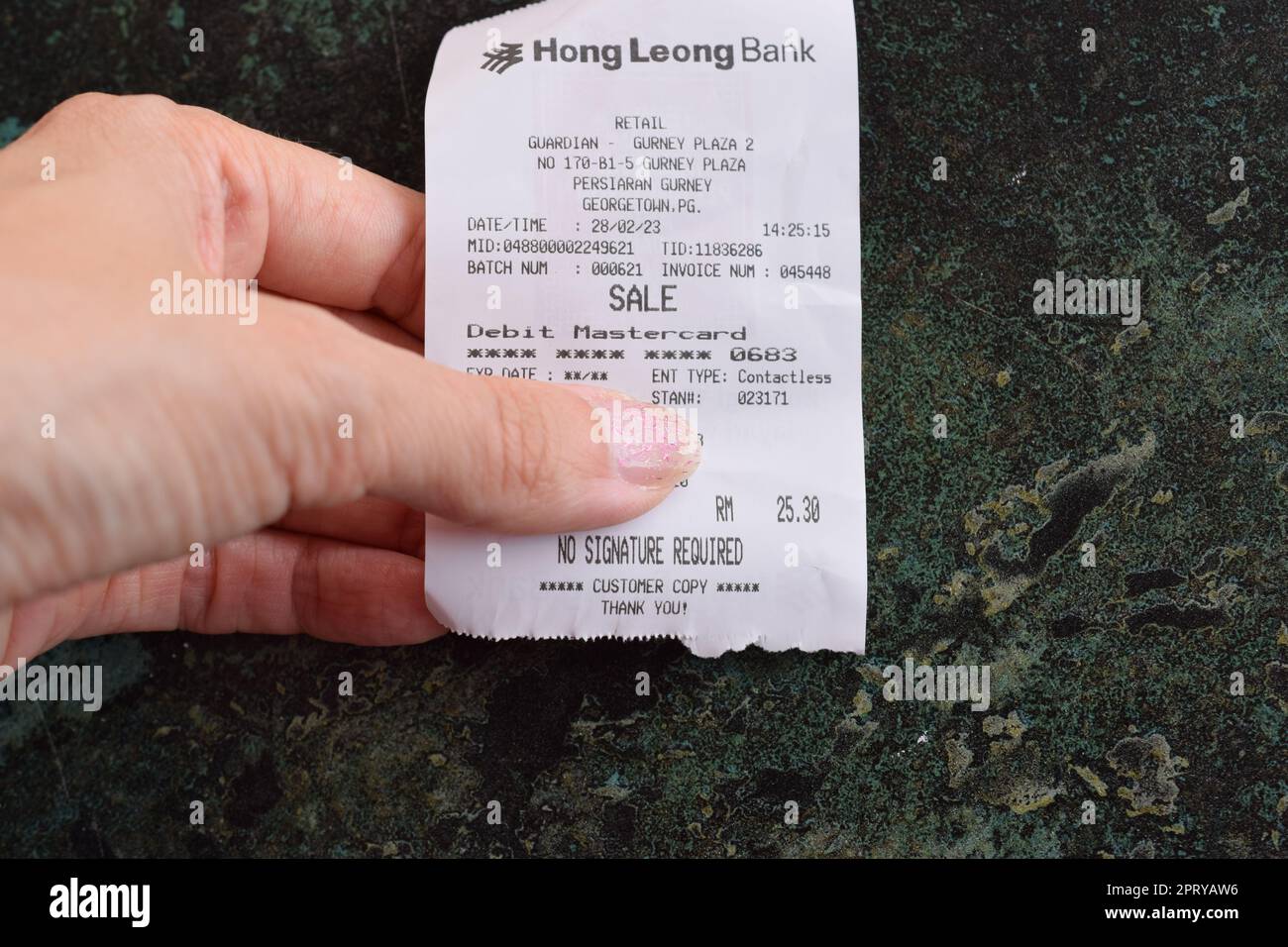 Hong Leong Bank recept in hand Stock Photo - Alamy
