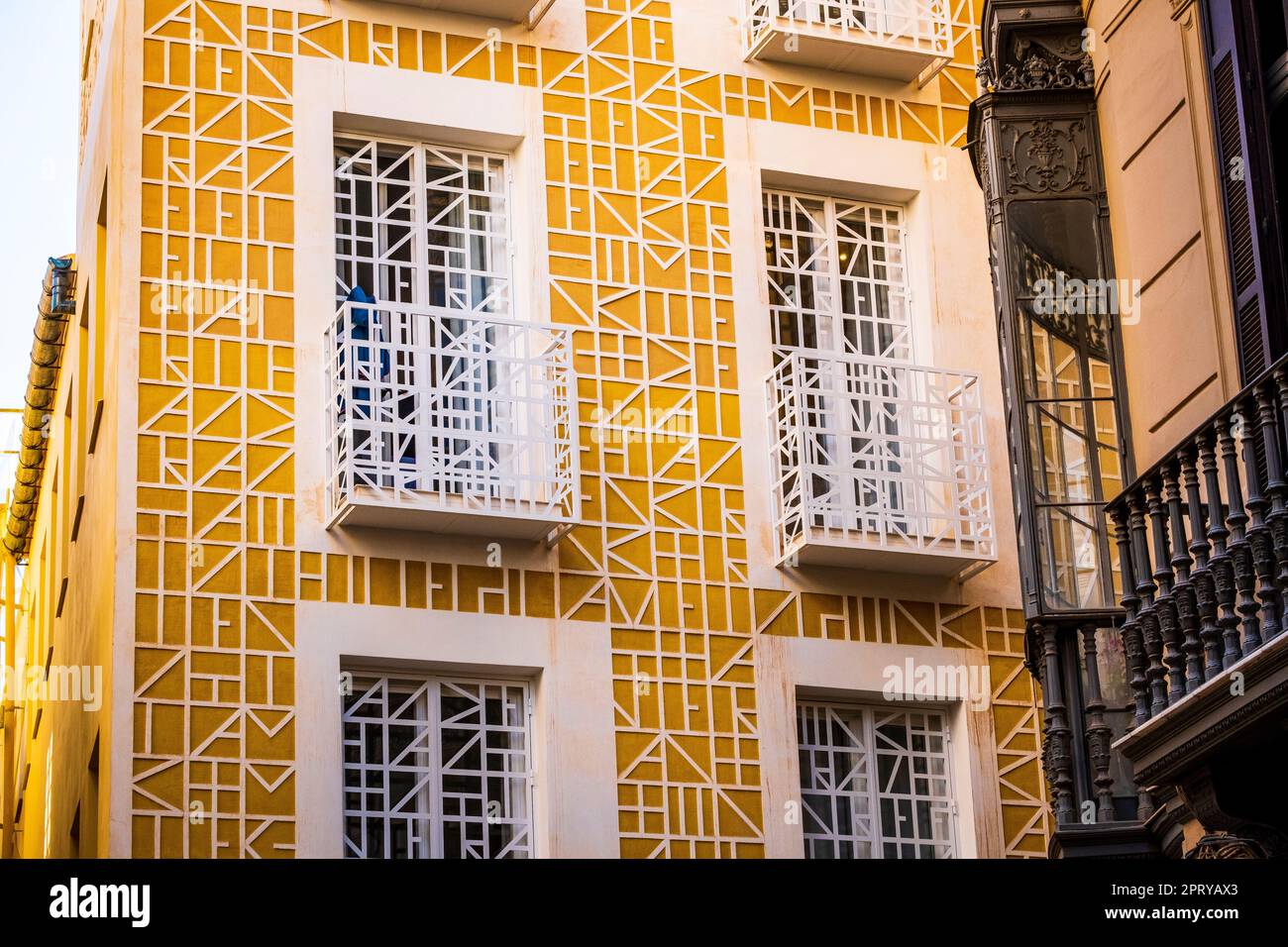 Ornate patterns on the side of a house in the historic center of Málaga ...