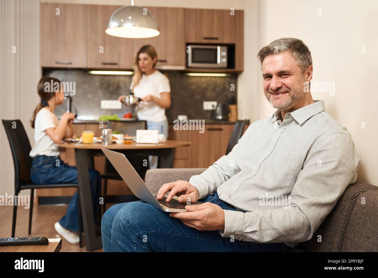 Happy man with his family together in the morning in a hotel room Stock ...