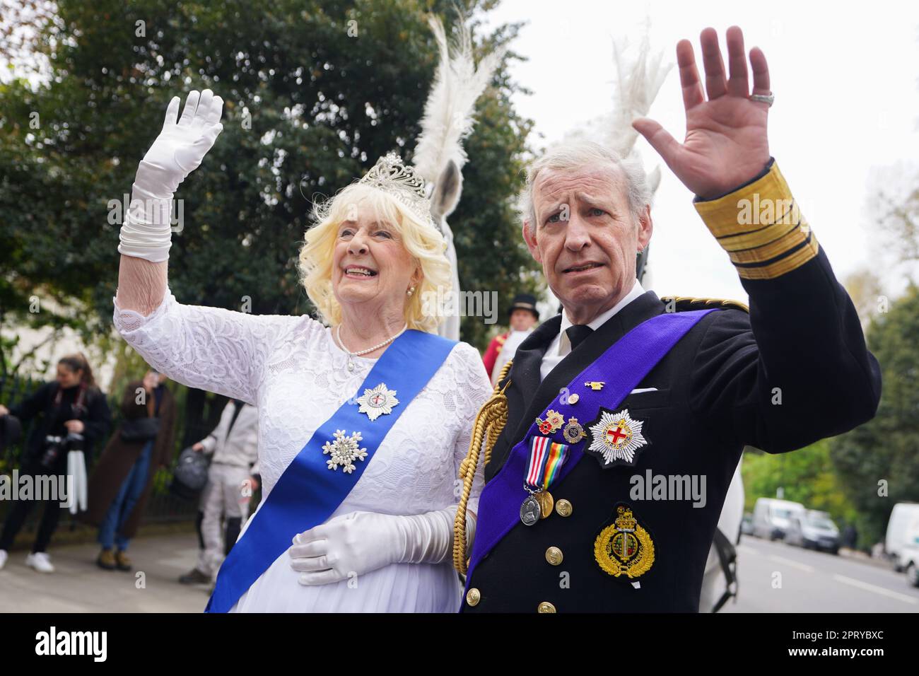 King Charles III and Queen Consort impersonators are driven through ...