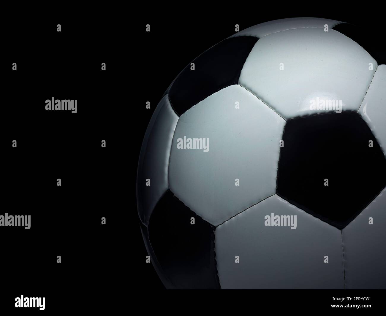 Soccer ball on black background Stock Photo - Alamy