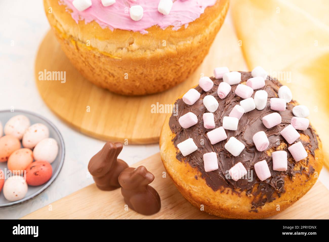 Homemade glazed and decorated easter pies with chocolate eggs and ...