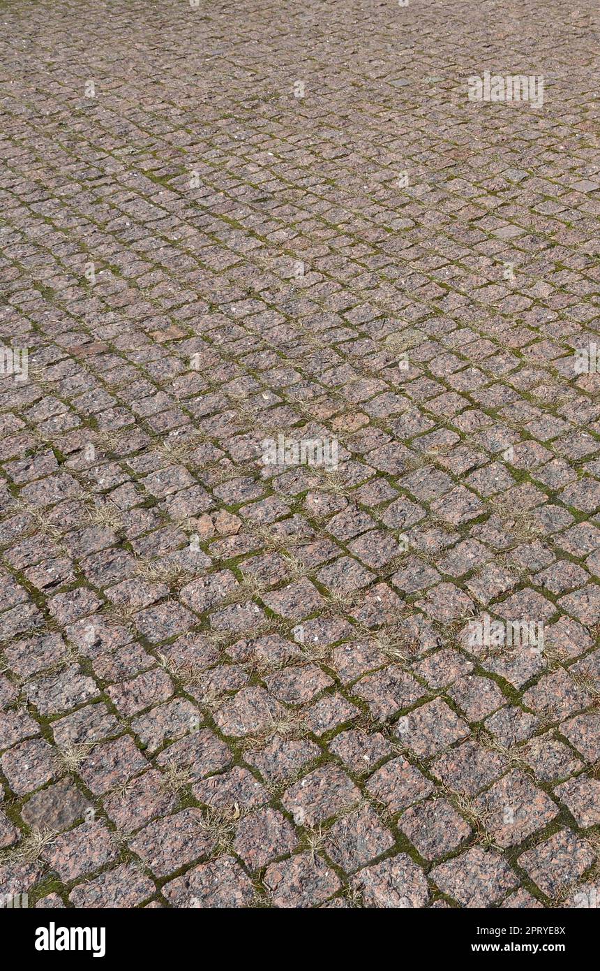 A large area, laid out of paving stone in perspective. Detailed photo ...