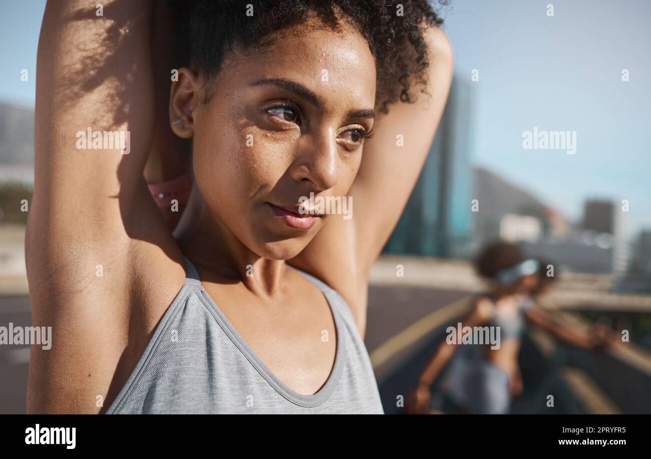 Fitness, city and woman doing a stretching exercise before an outdoor ...