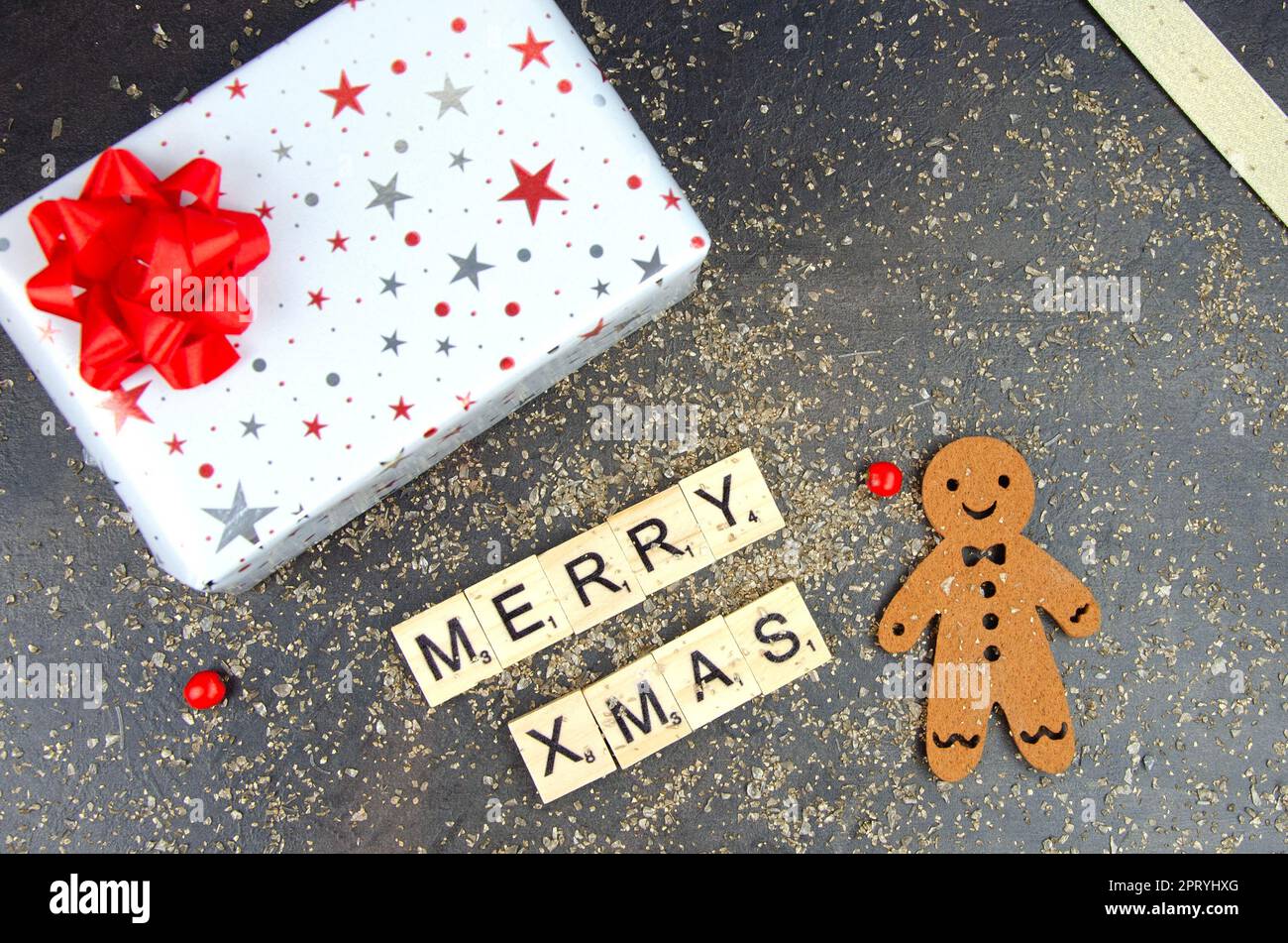 Happy christmas message with present and gingerbread man Stock Photo ...