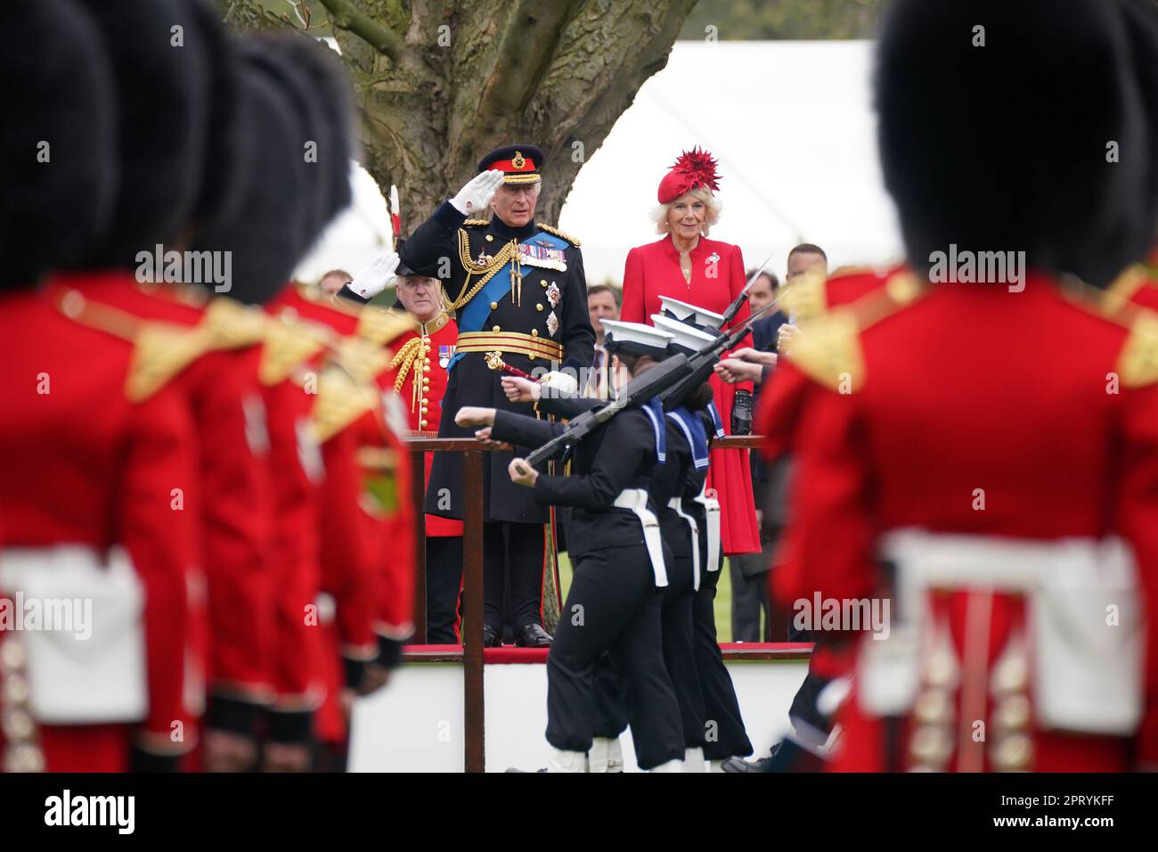 King Charles III and the Queen Consort, receiving a Royal Salute from ...