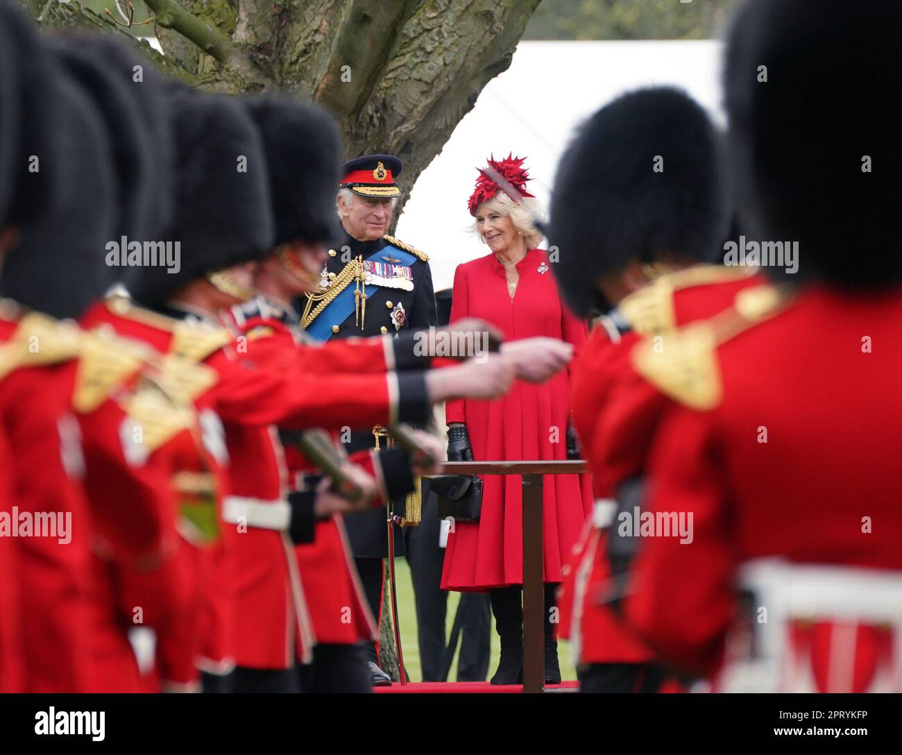 King Charles III and the Queen Consort stood before The King's Company ...