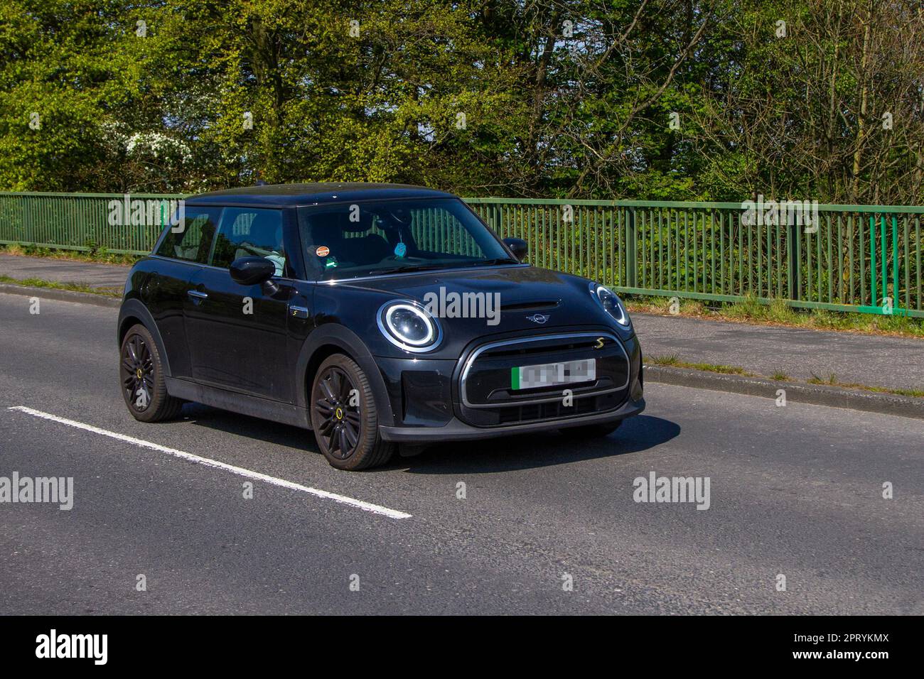 Hybrid Mini Cooper crossing motorway bridge in Greater Manchester, UK ...