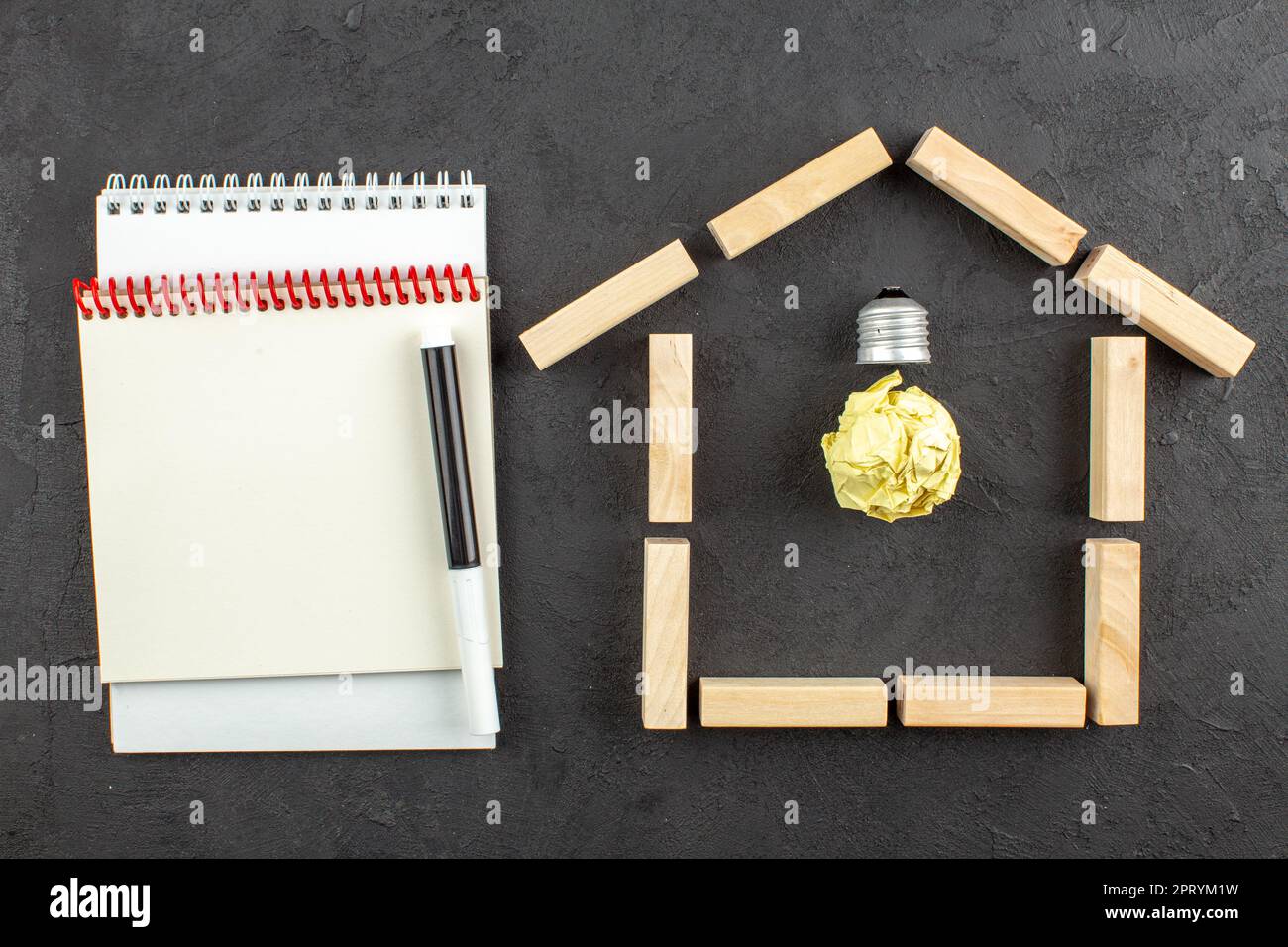 top view idealight bulb in house shaped wood blocks notepad black ...