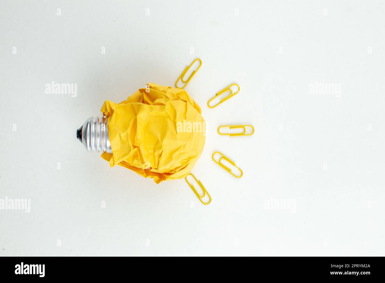 top view yellow idealight bulb gem clips on white background Stock ...