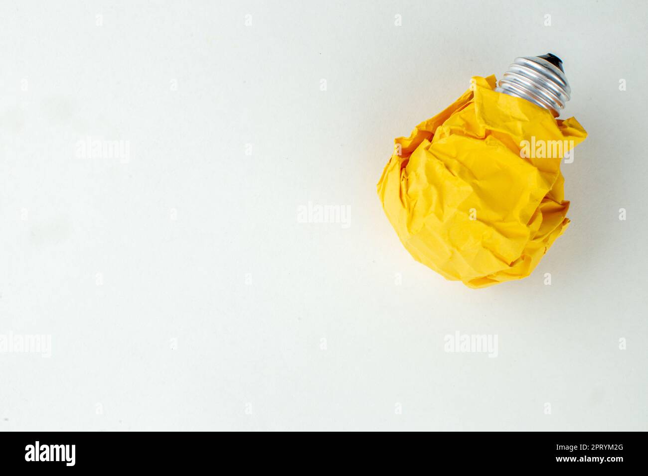 top view yellow idealight bulb on white background with free space ...