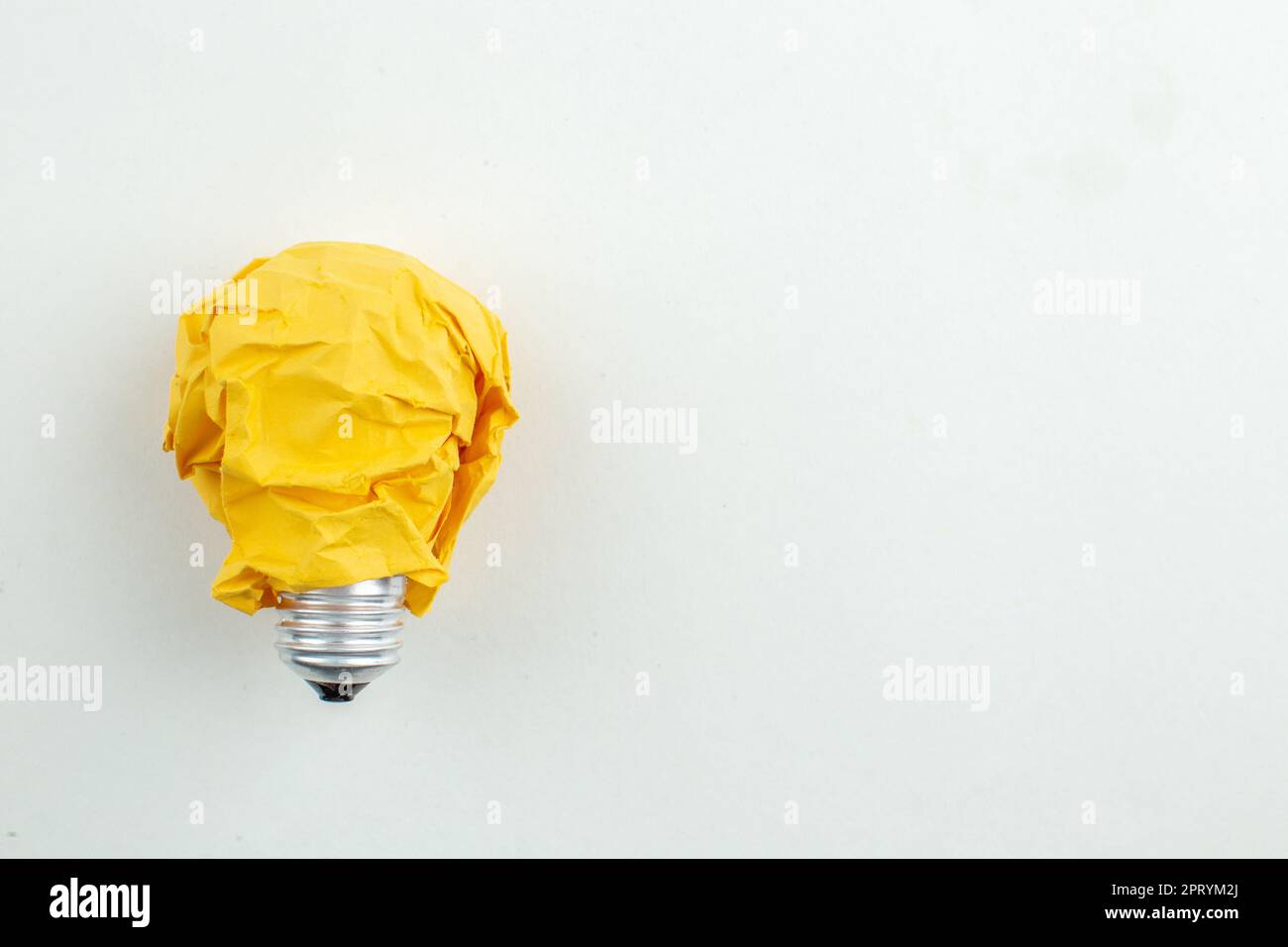 top view yellow idealight bulb on white background with copy space ...