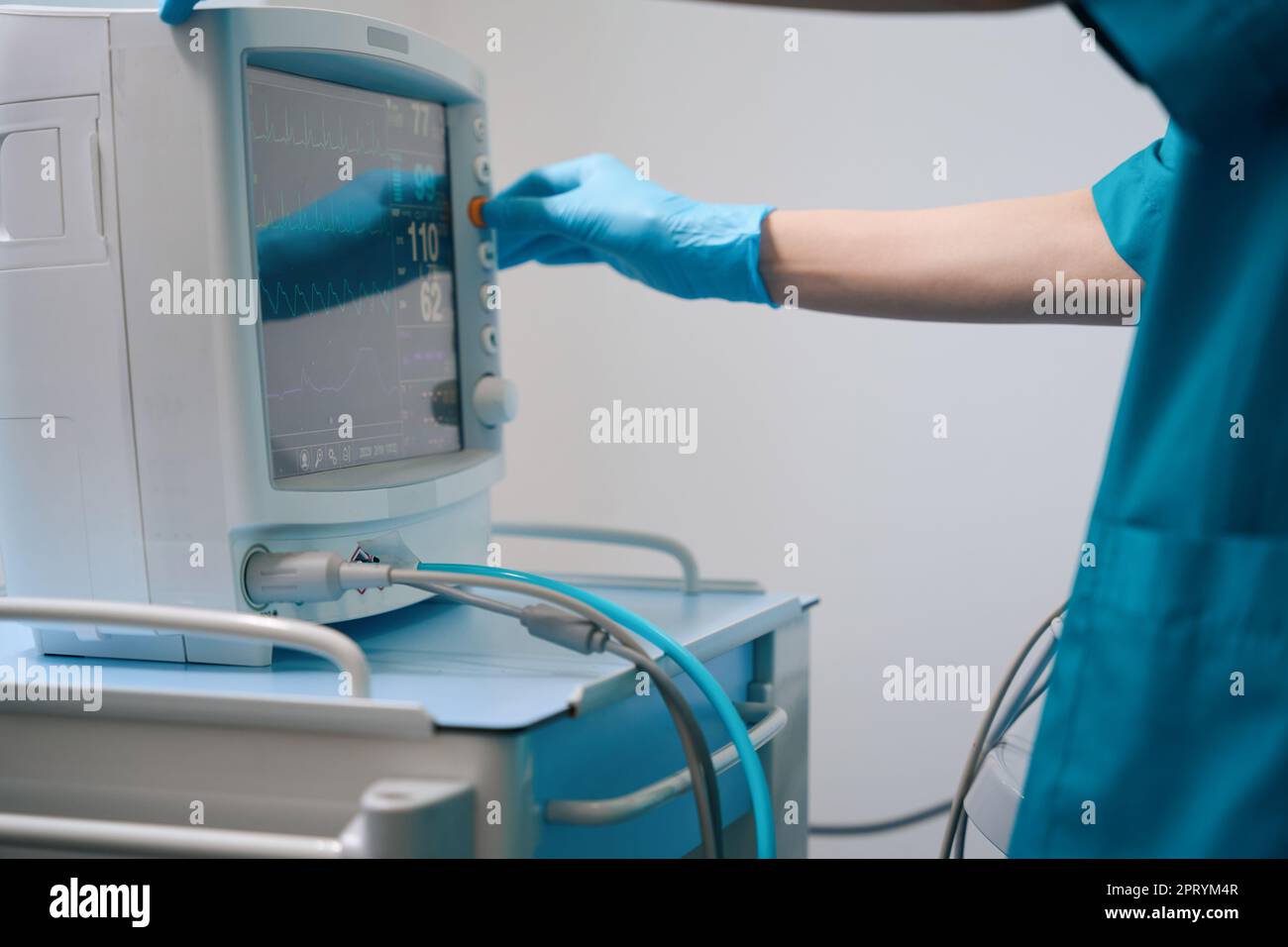 Medical worker works with an ultrasound machine in diagnostic center ...