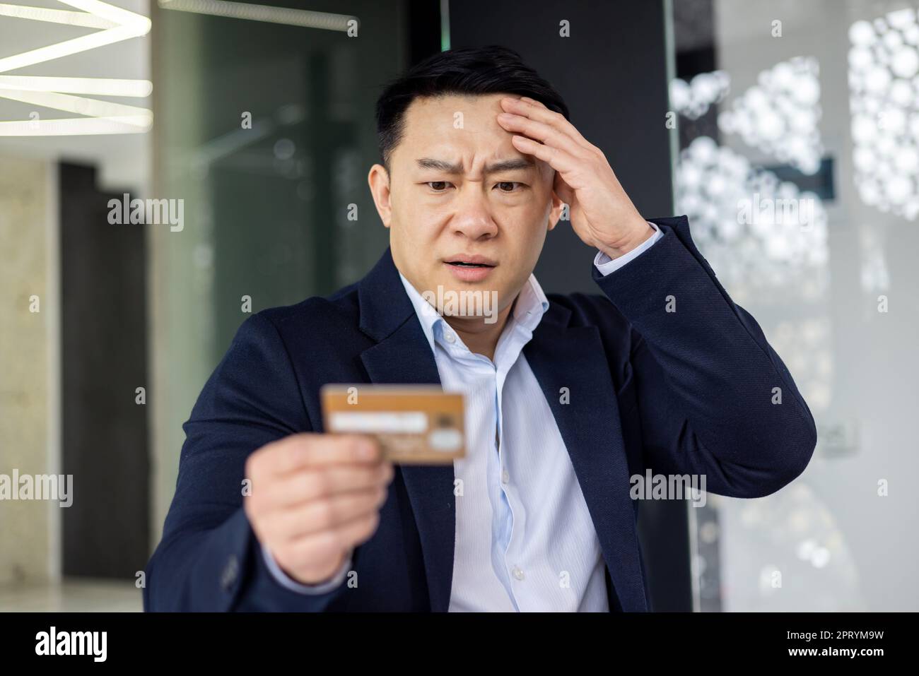 Cheated and disappointed businessman working inside office, man trying ...