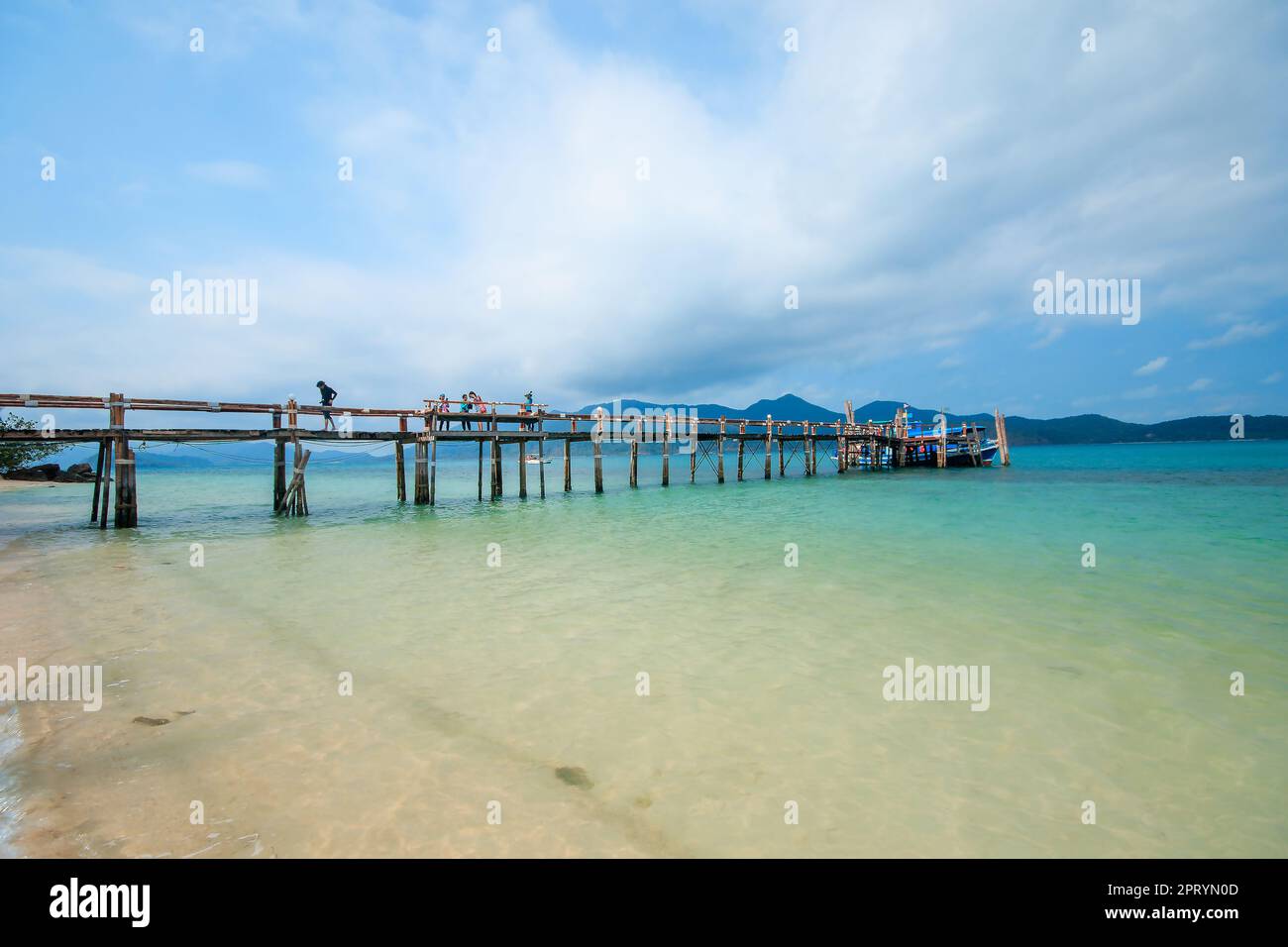 Wooden bridge extending into the sea Stock Photo - Alamy