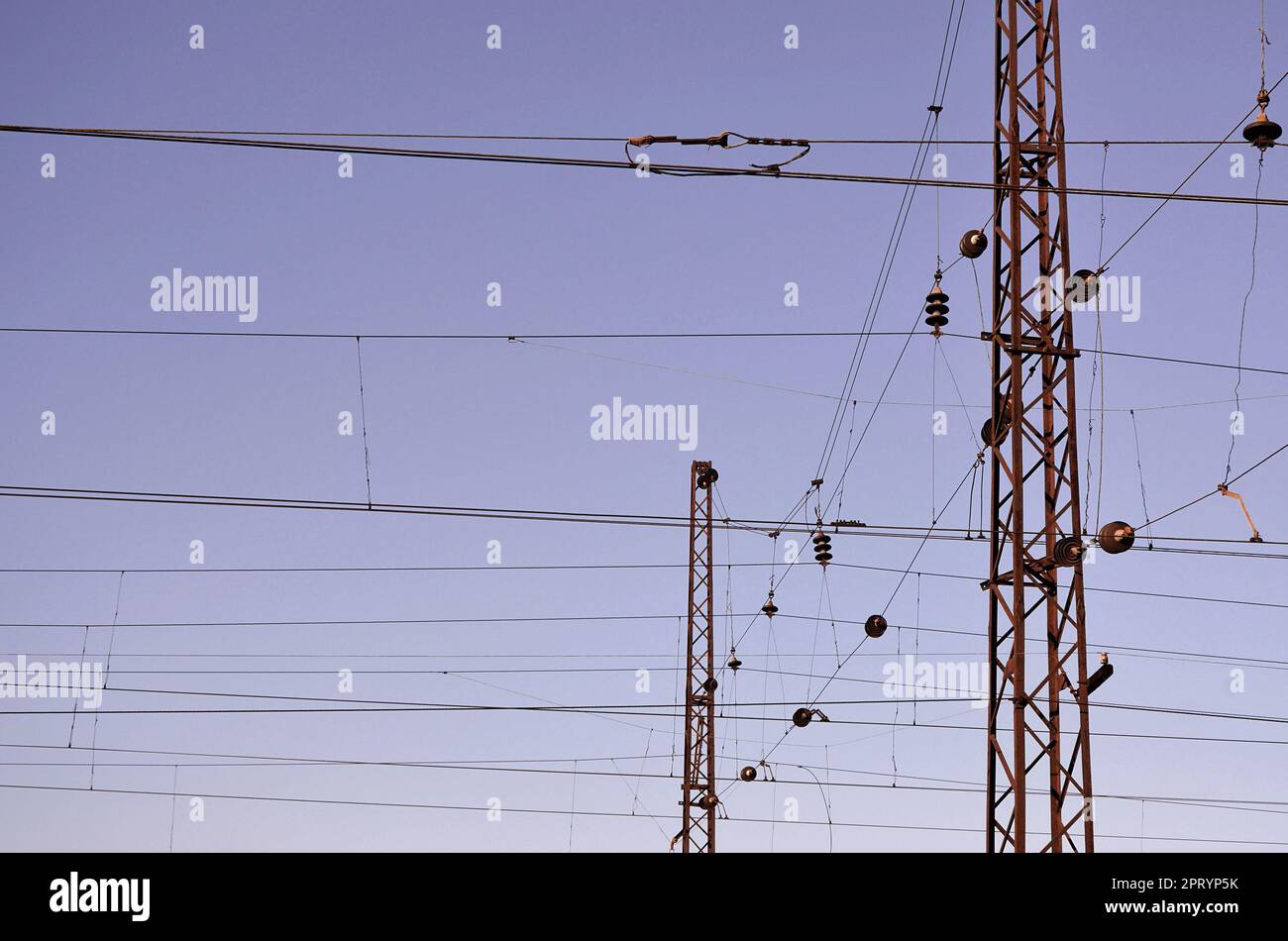 Railroad overhead lines against clear blue sky, Contact wire. High ...