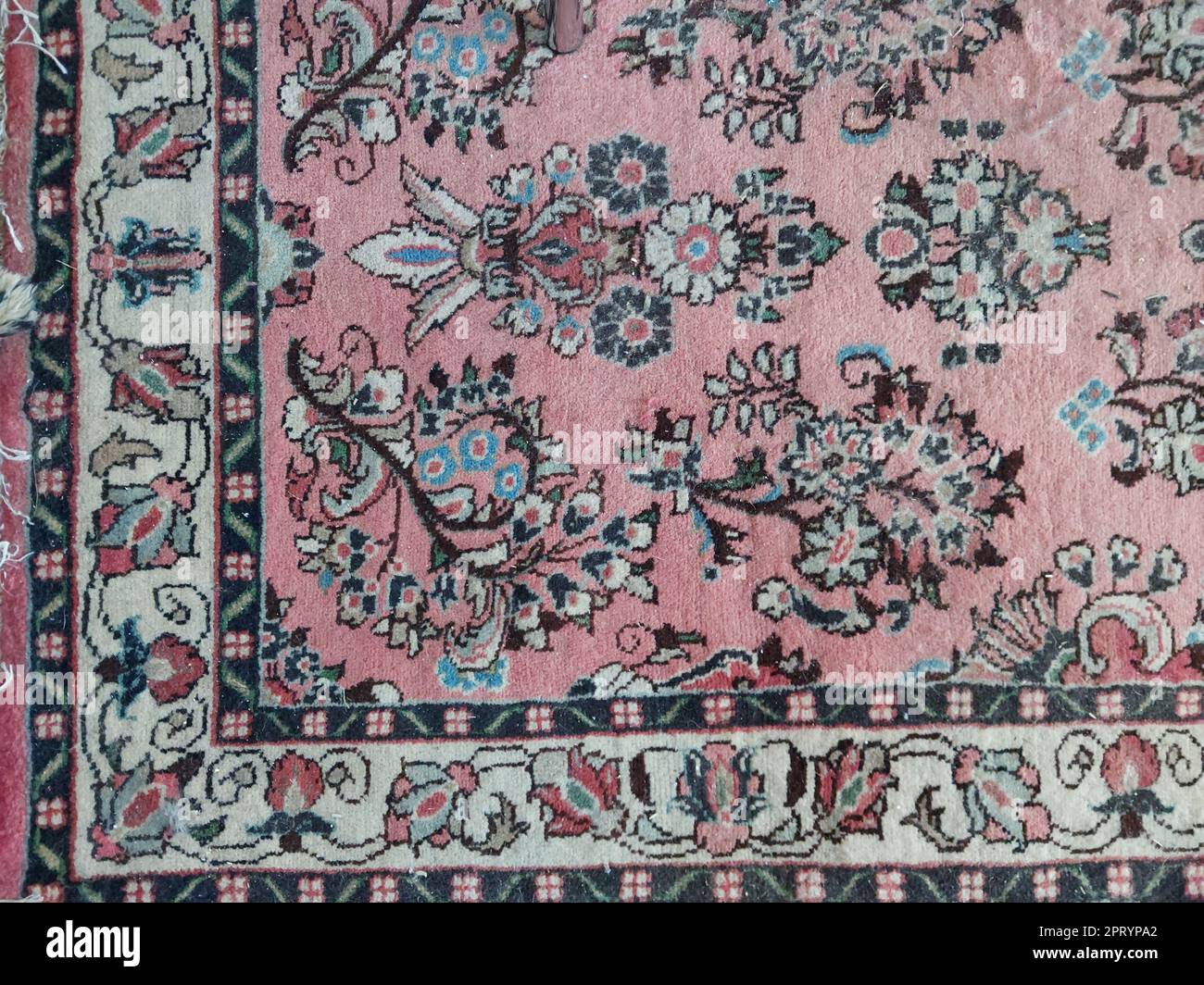 Patterns in the hand-embroidered Iranian carpet Stock Photo - Alamy