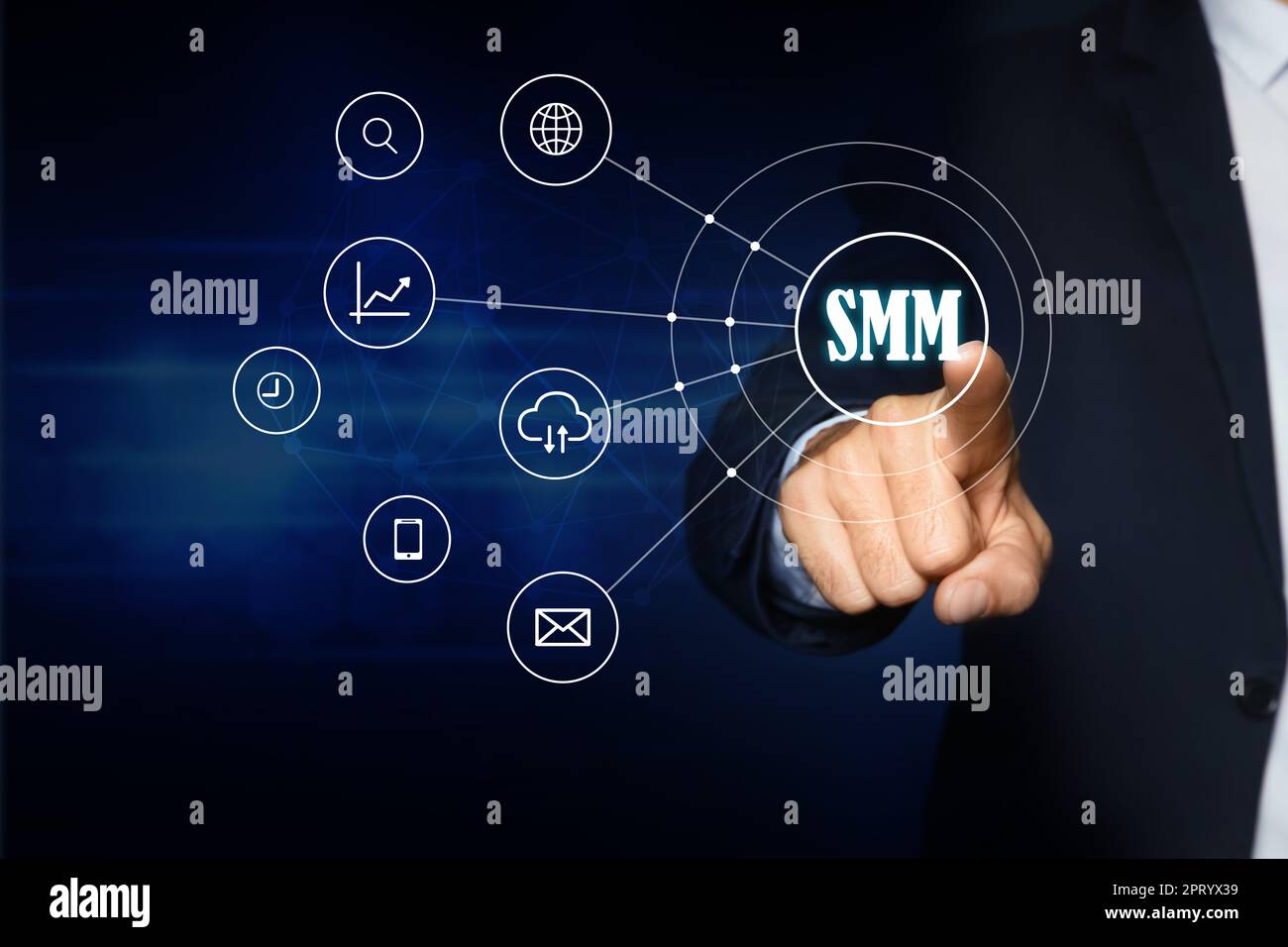 Social media marketing concept. Man touching virtual icon SMM on dark ...