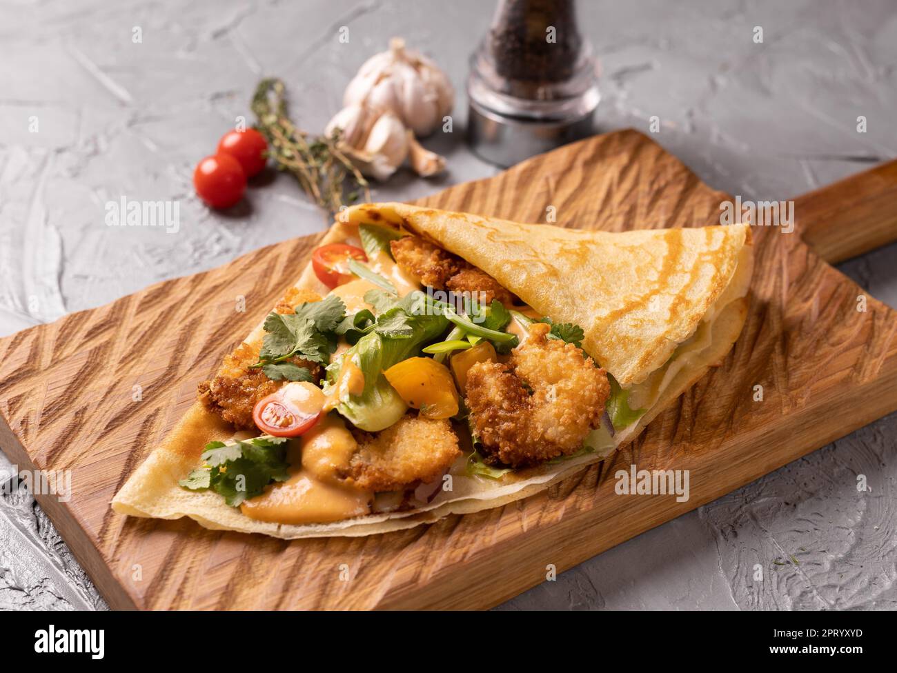 Pancake or crepe with fried shrimp tomatoes and vegetables Stock Photo - Alamy
