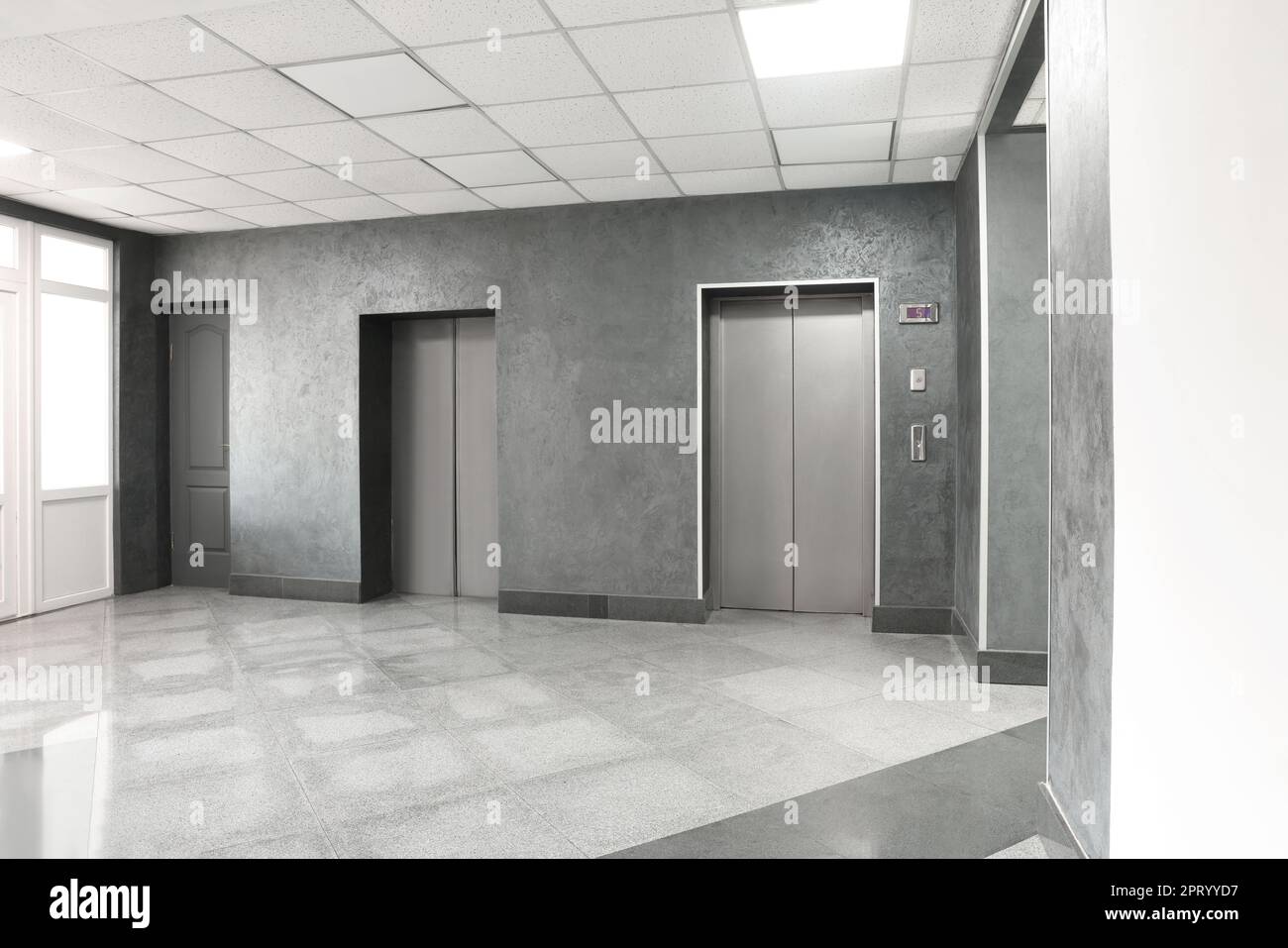 Closed stylish elevator doors in clean hall Stock Photo - Alamy