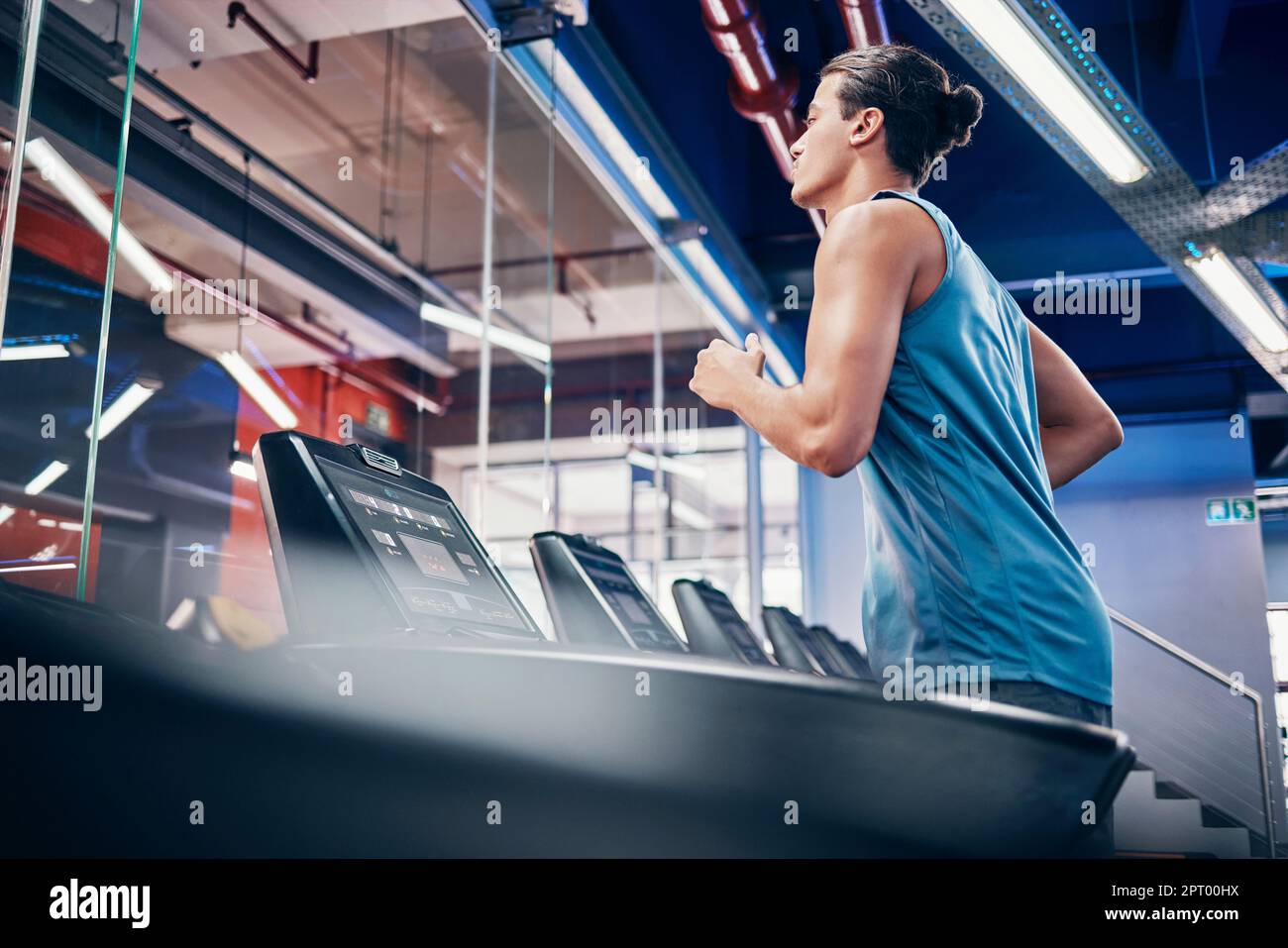 Gym, fitness and man running on treadmill for health, wellness and ...