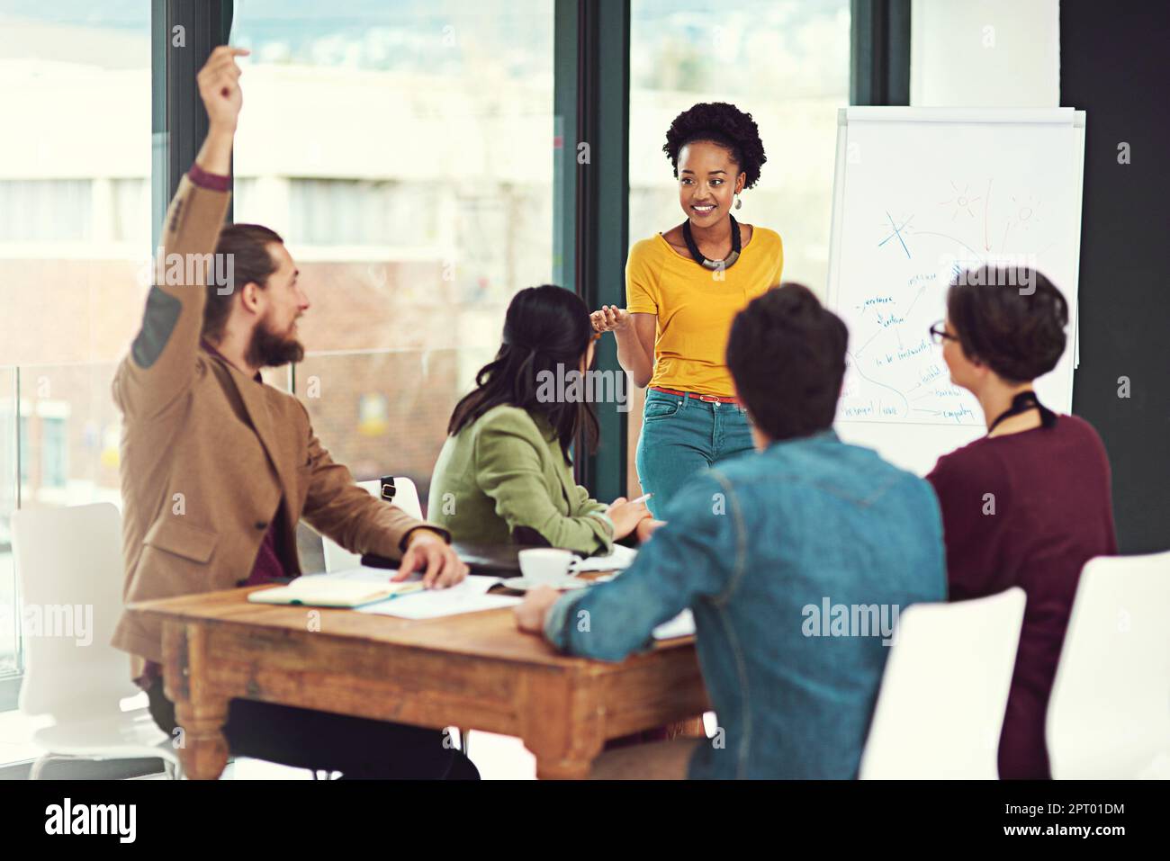 Everyones input is important. a young creative giving a presentation to ...