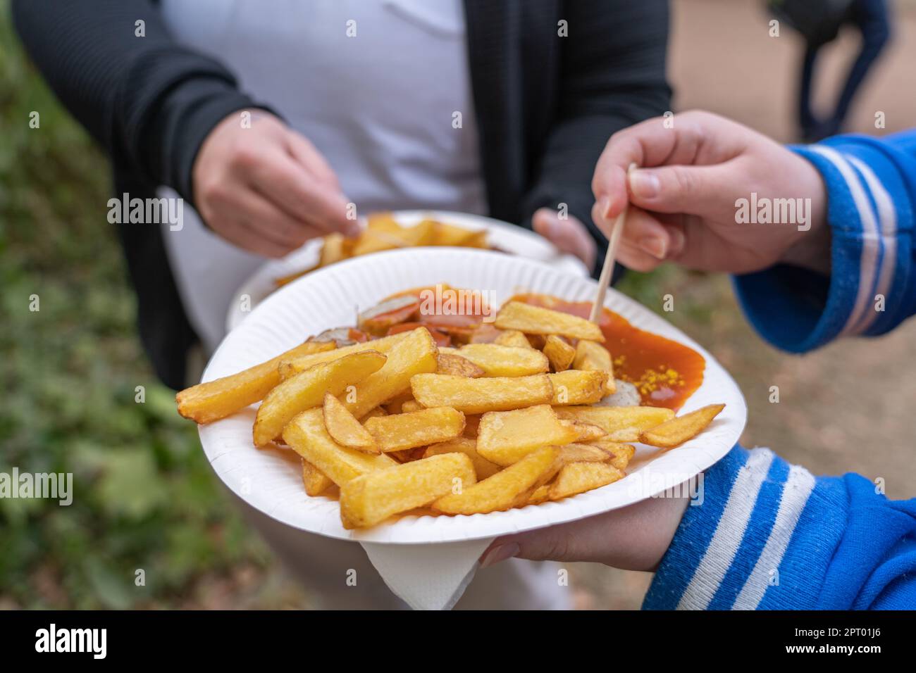 Paper plate with traditional German Currywurst and french fries Stock ...