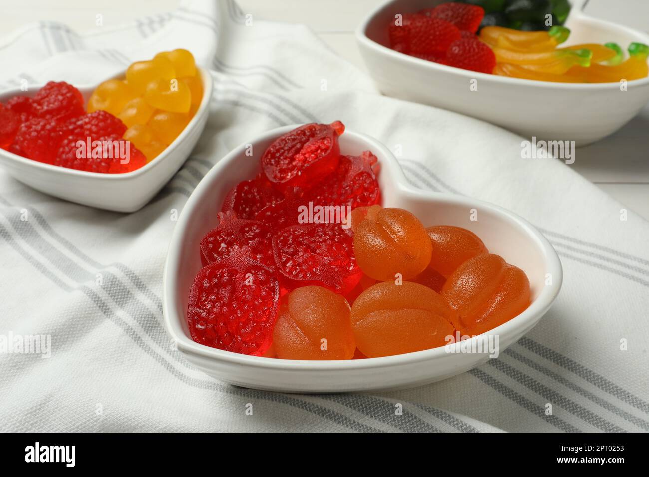 Delicious gummy fruit shaped candies on table Stock Photo - Alamy