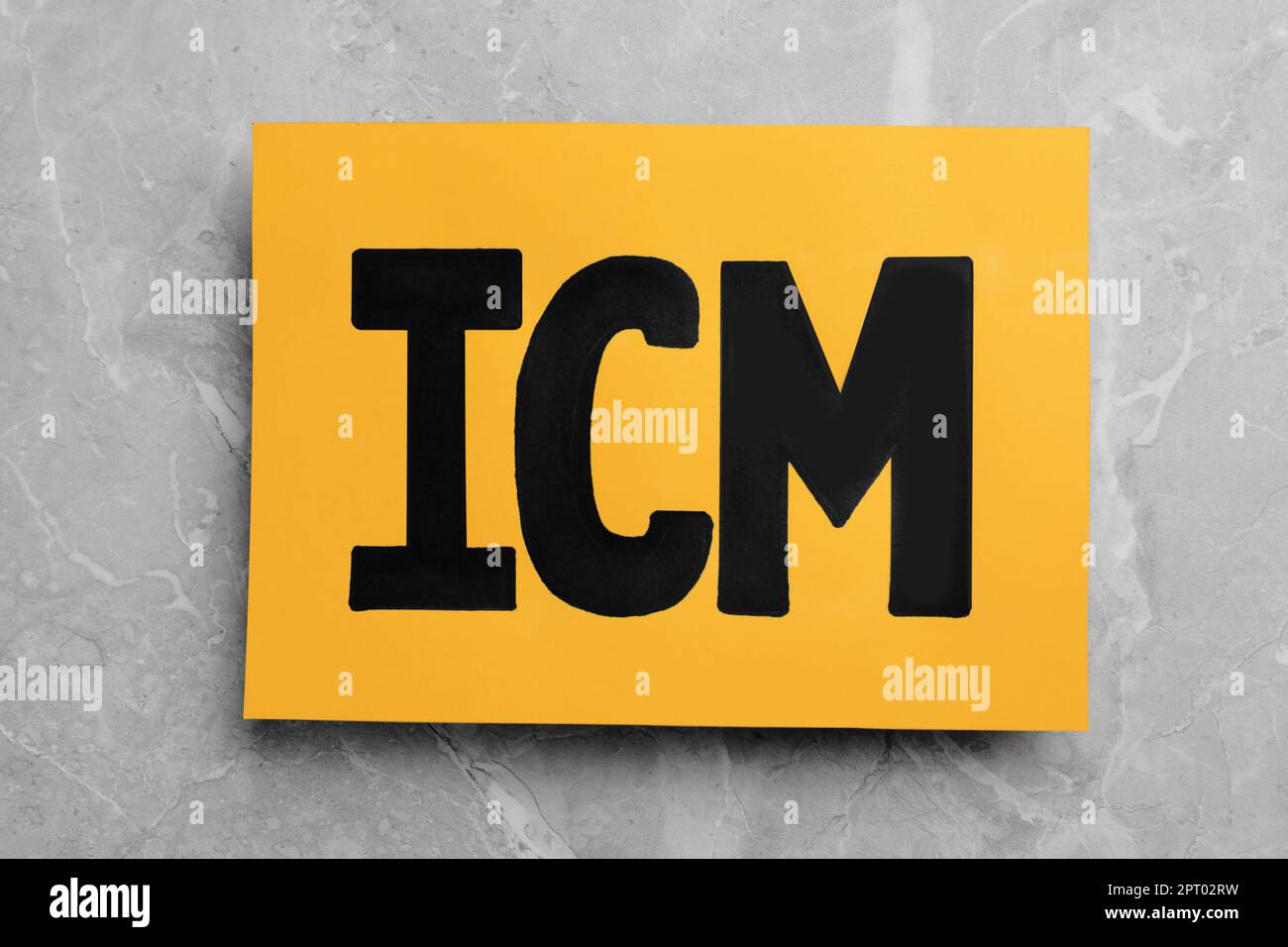 Orange paper with abbreviation ICM (International Cash Management) on ...