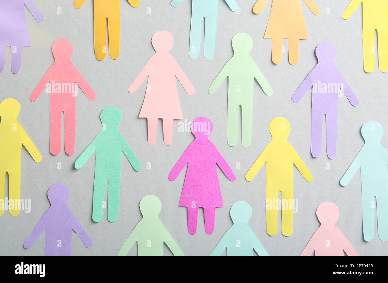 Many different paper human figures on grey background, flat lay ...