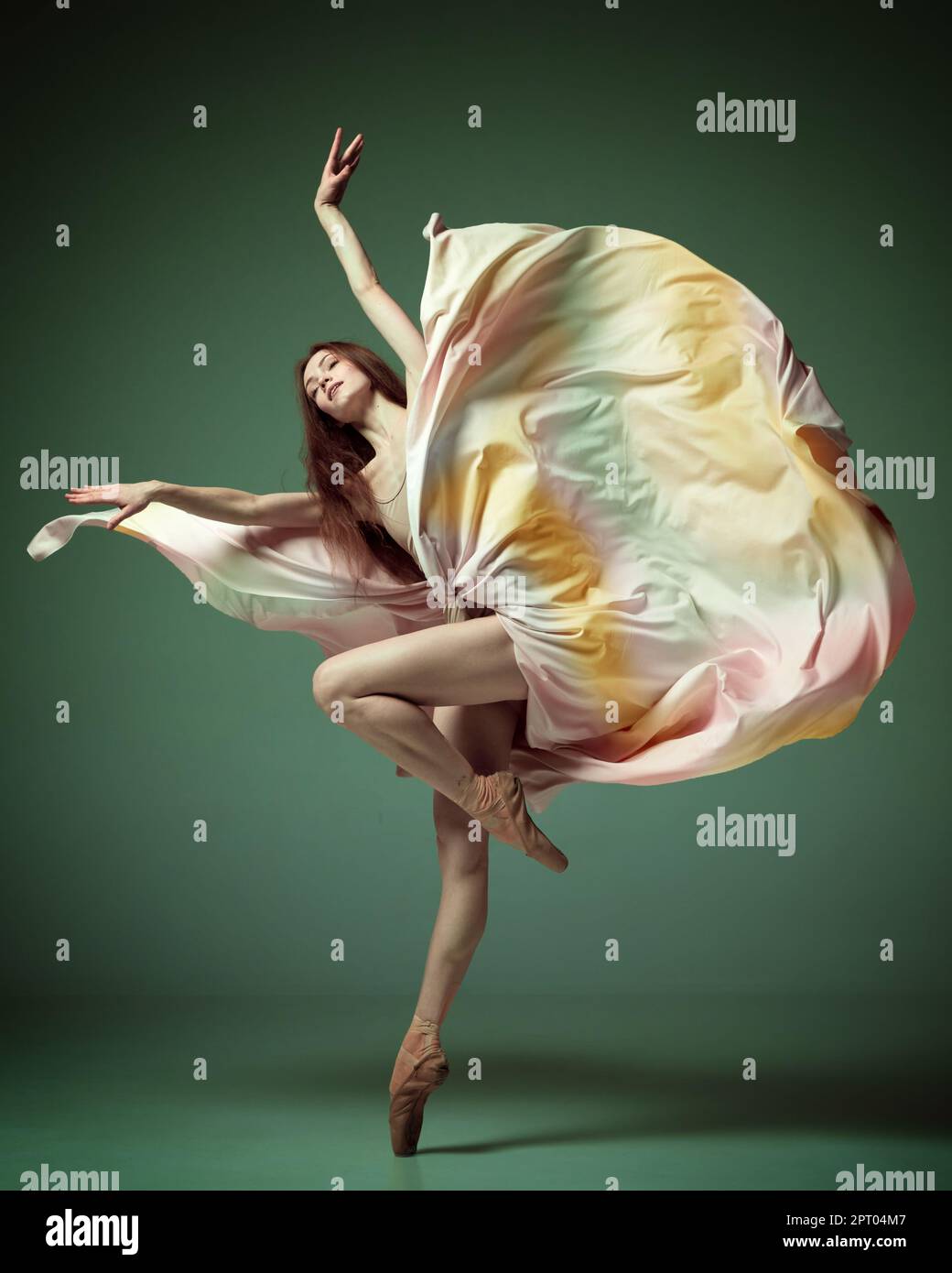 One beautiful adorable, young girl dancing gracefully with with fabric ...