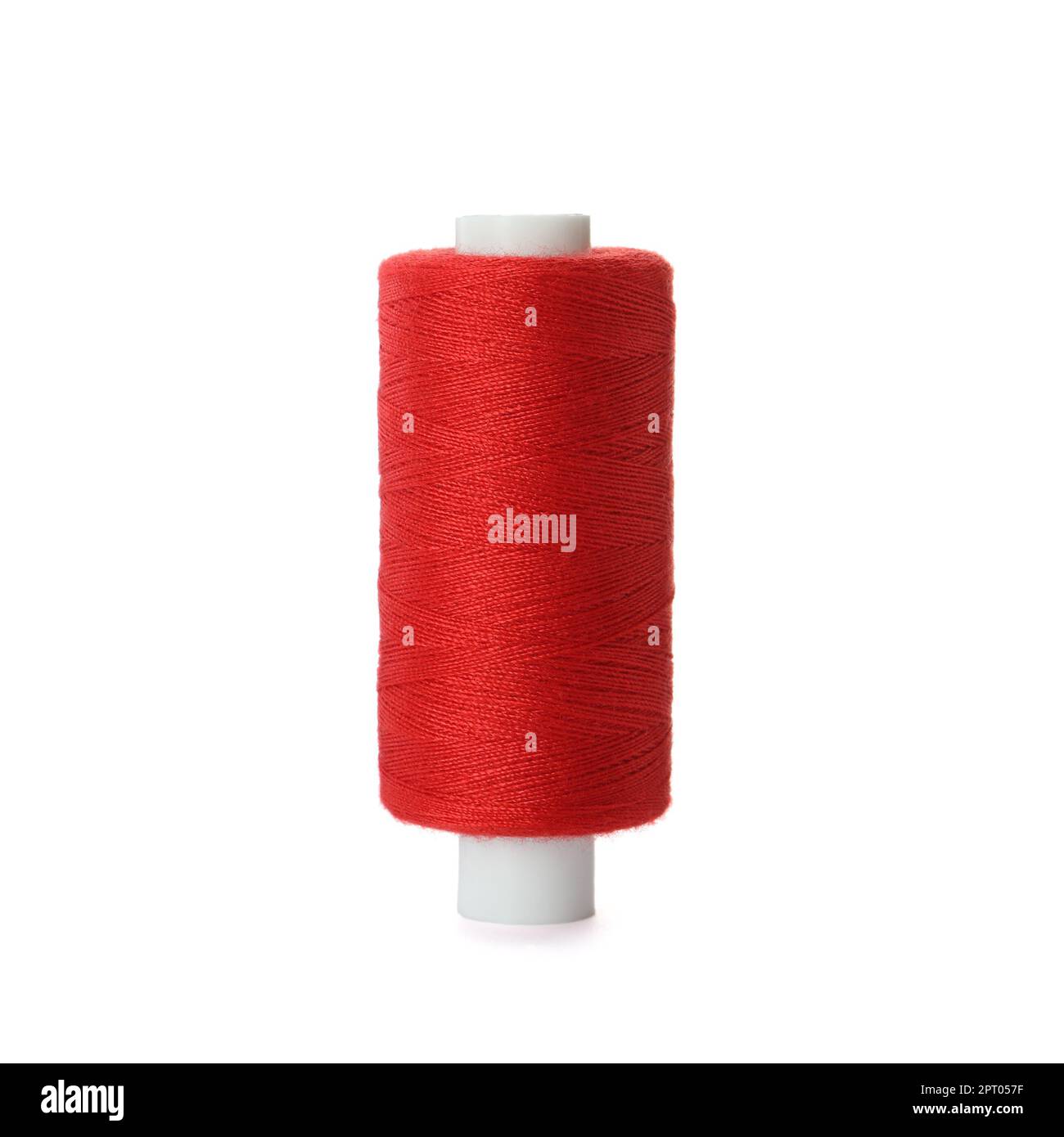 Spool of red sewing thread isolated on white Stock Photo - Alamy