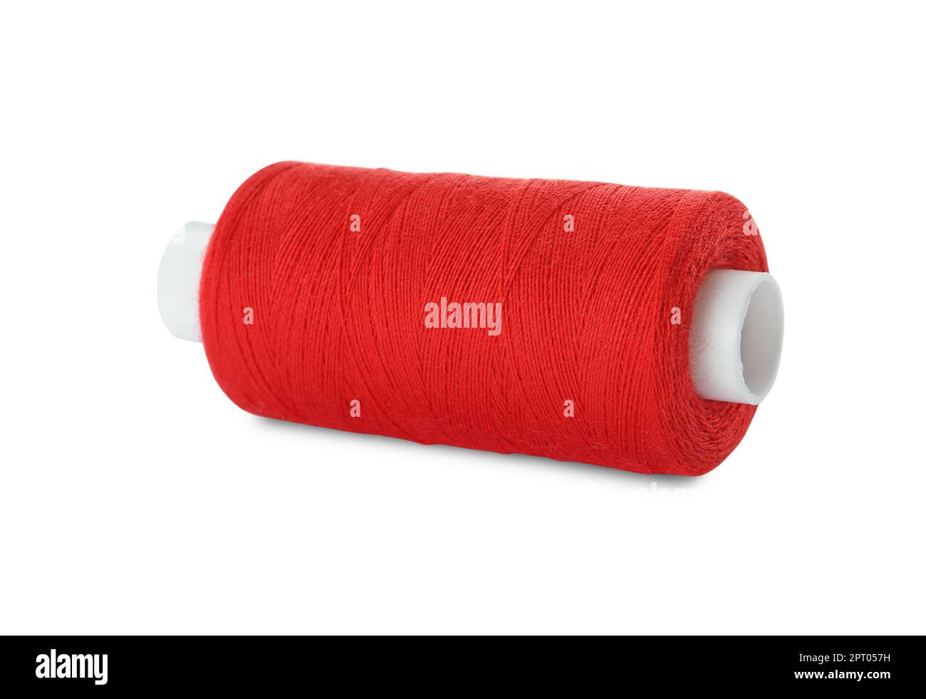 Spool of red sewing thread isolated on white Stock Photo - Alamy