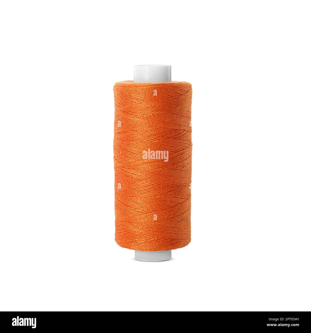Spool of orange sewing thread isolated on white Stock Photo - Alamy