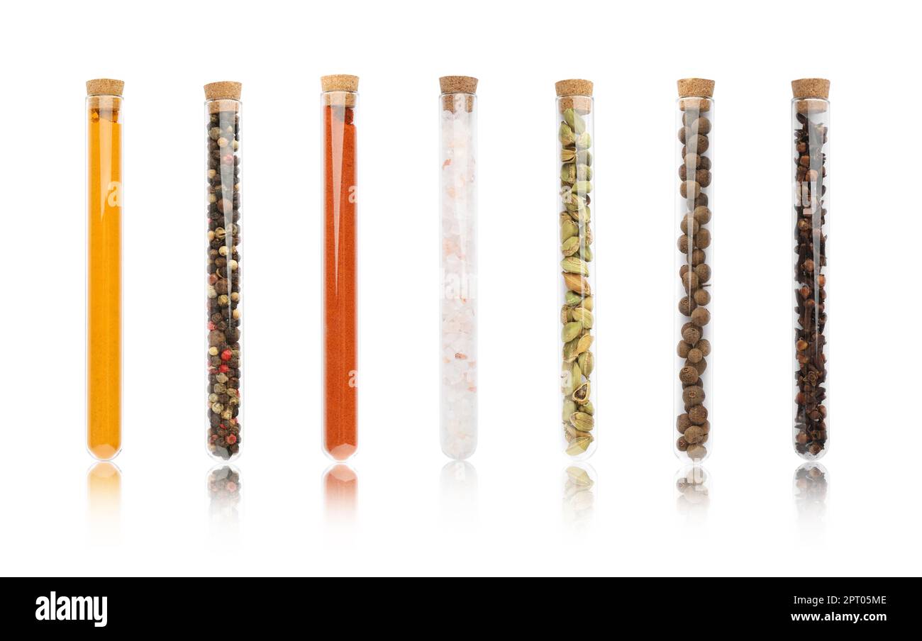 Set of glass tubes with different spices on white background Stock ...