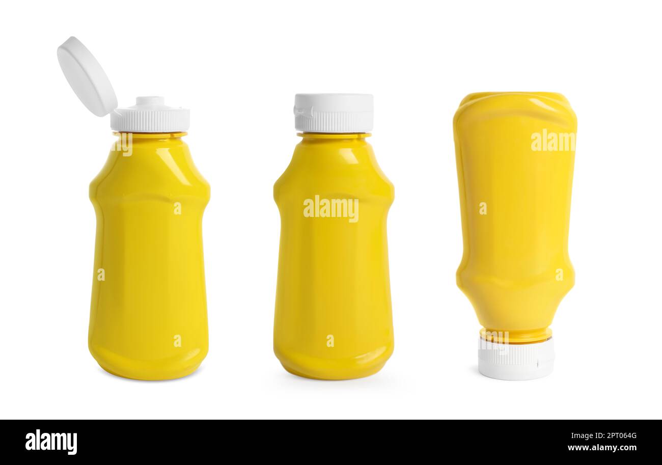 Set with spicy mustard in plastic bottles on white background Stock ...