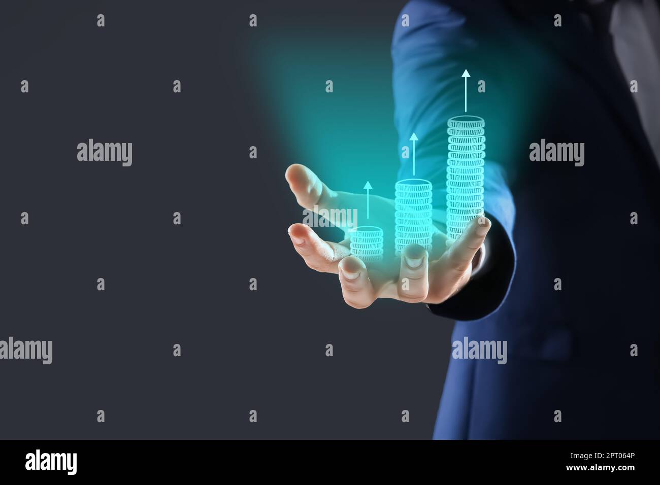Salary increase concept. Man showing virtual image of stacked coins and ...